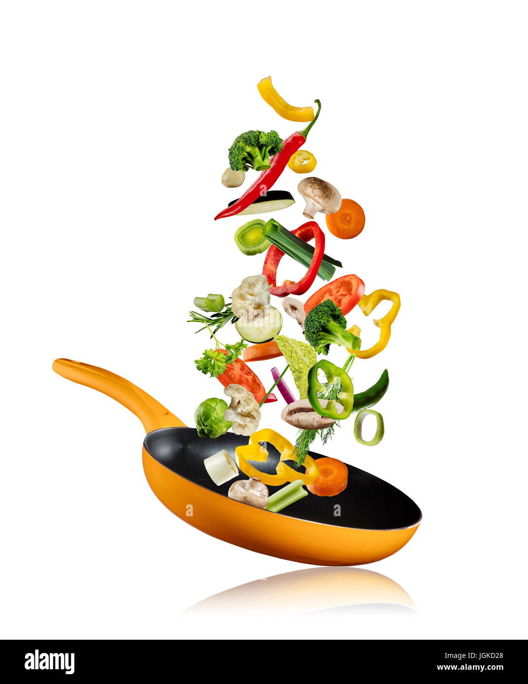 Fresh vegetables flying into a pan, isolated on white background Stock ...
