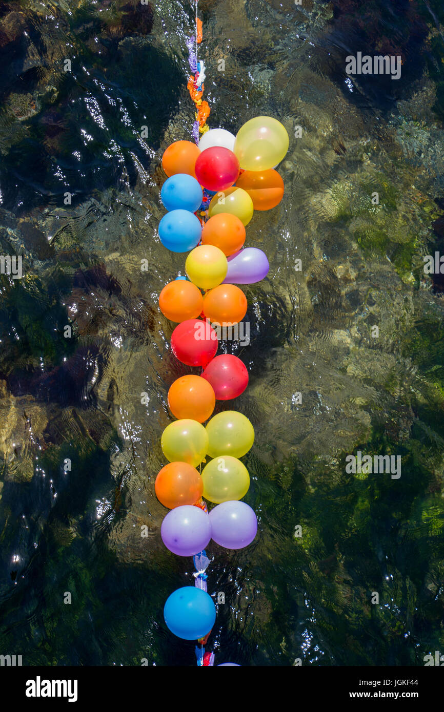Balloons in shooting range as targets on water Stock Photo - Alamy