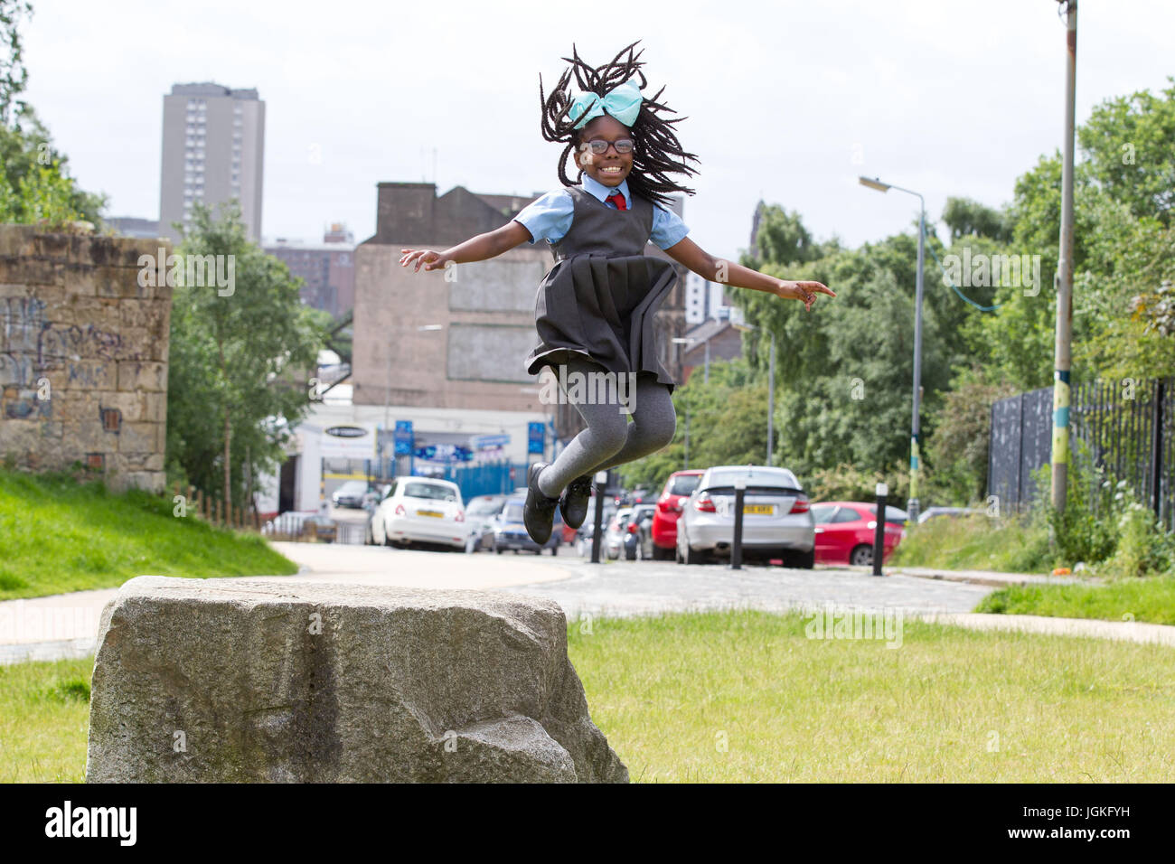 girl jumping off wall Stock Photo - Alamy