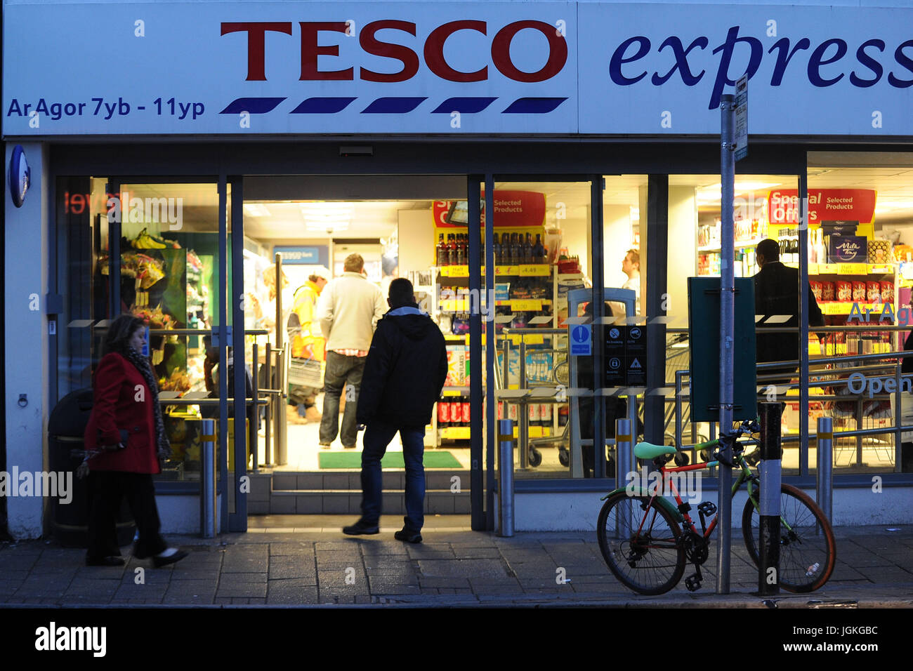 General view of a Tesco Express supermarket store during the evening ...