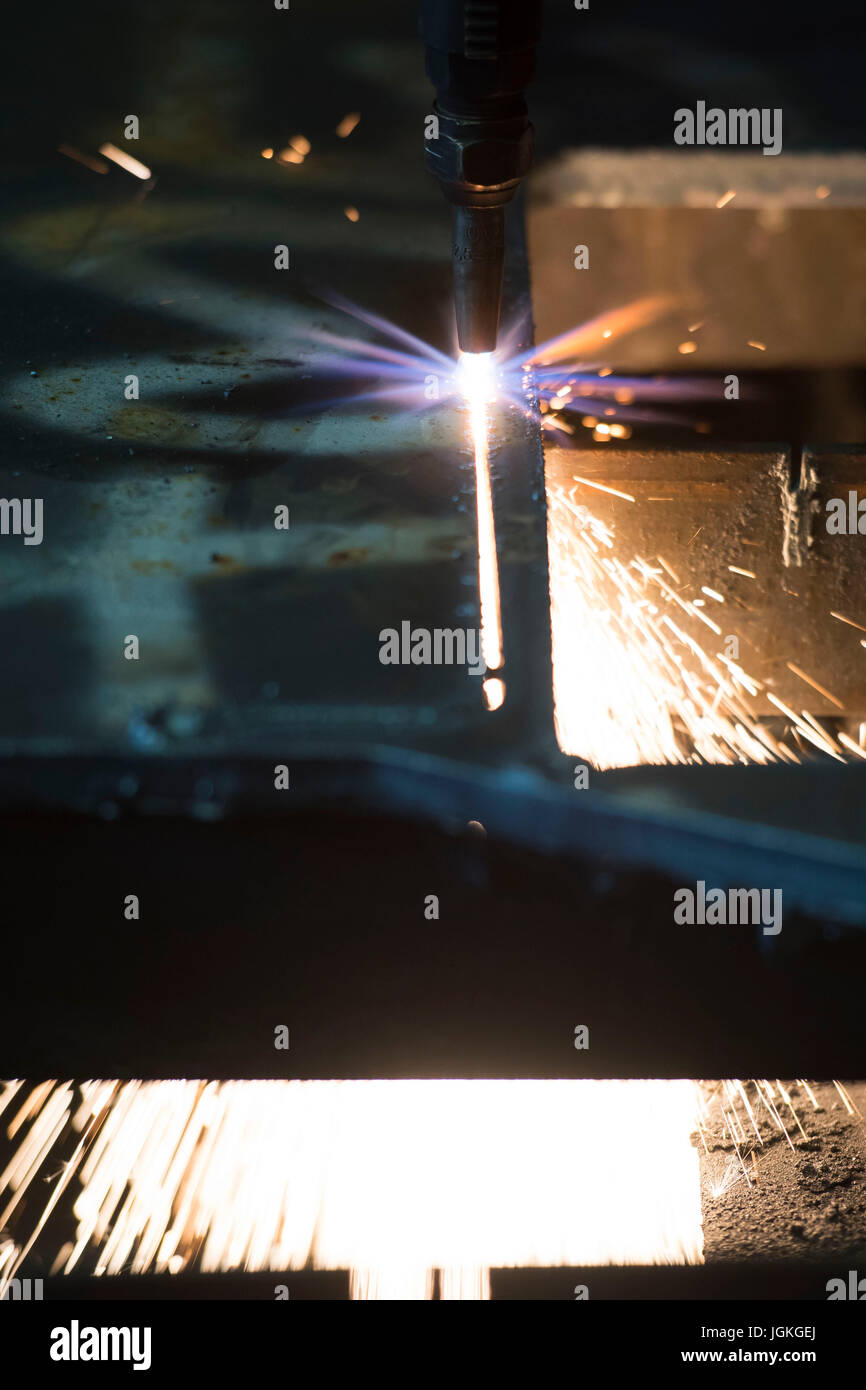 A steel cutting machine at work in a factory Stock Photo - Alamy