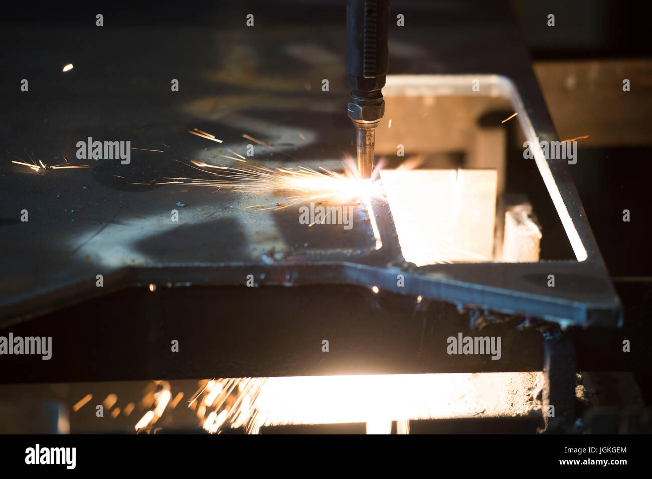 A steel cutting machine at work in a factory Stock Photo - Alamy