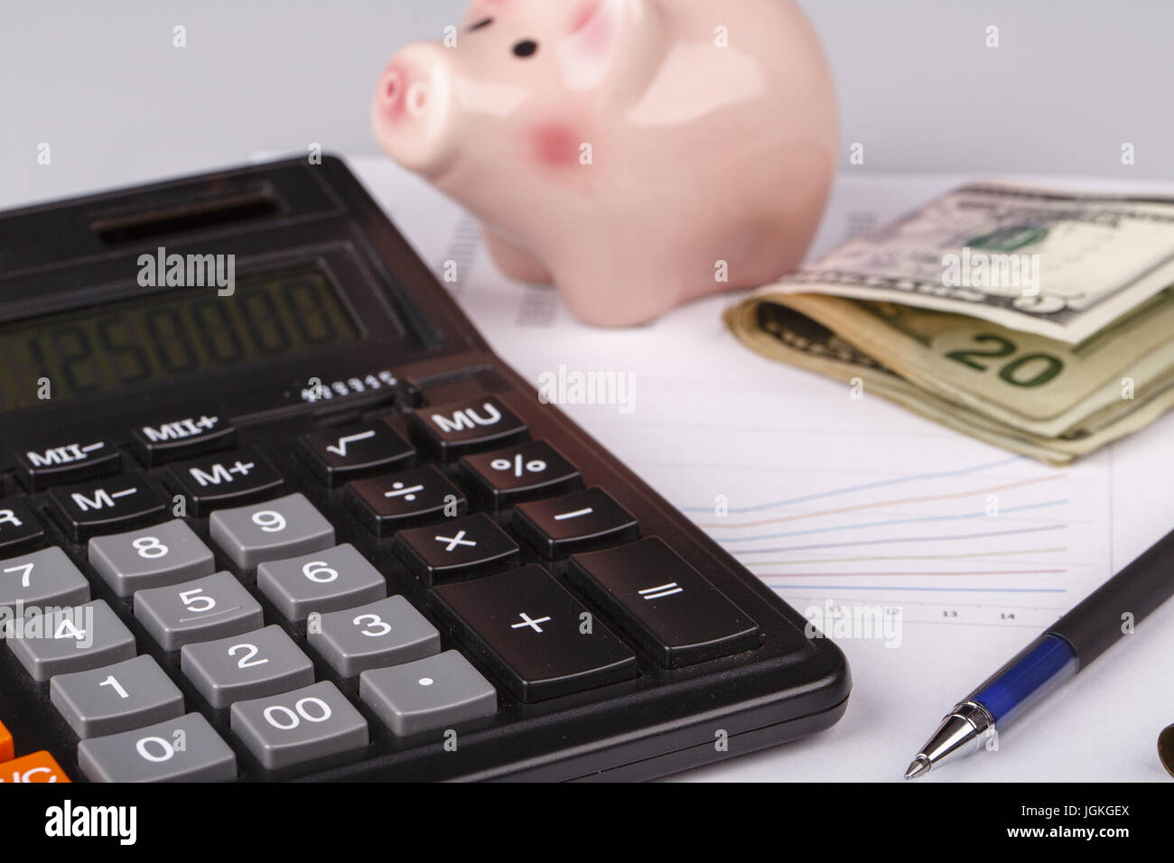Business Charts with calculator, dollars money, piggy box / money box ...