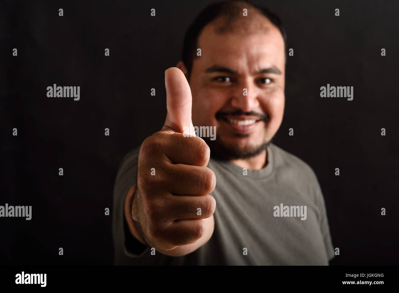 man doing the sign thumbs up on white background Stock Photo - Alamy