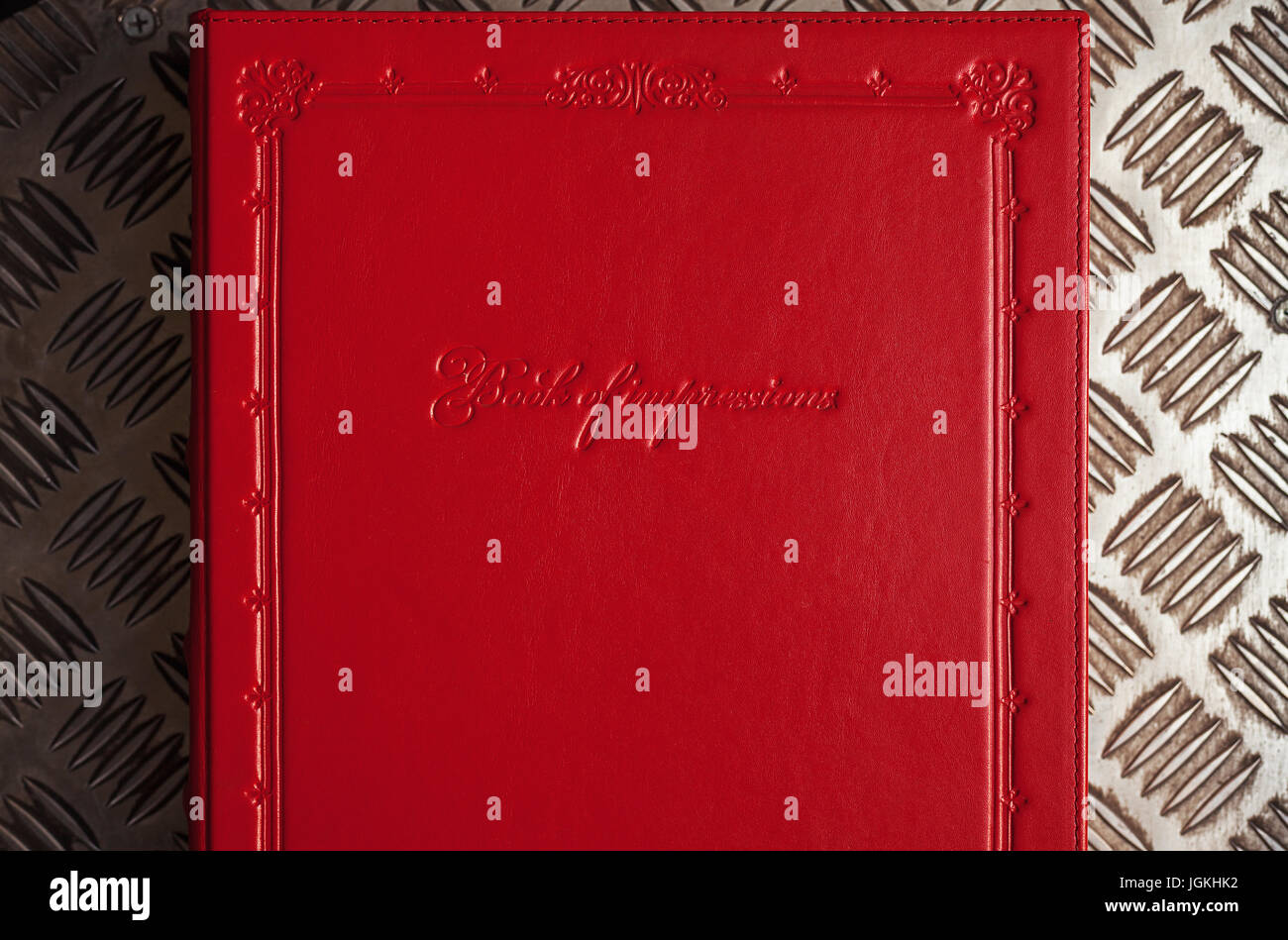 Closeup view of red leather book of impressions Stock Photo - Alamy