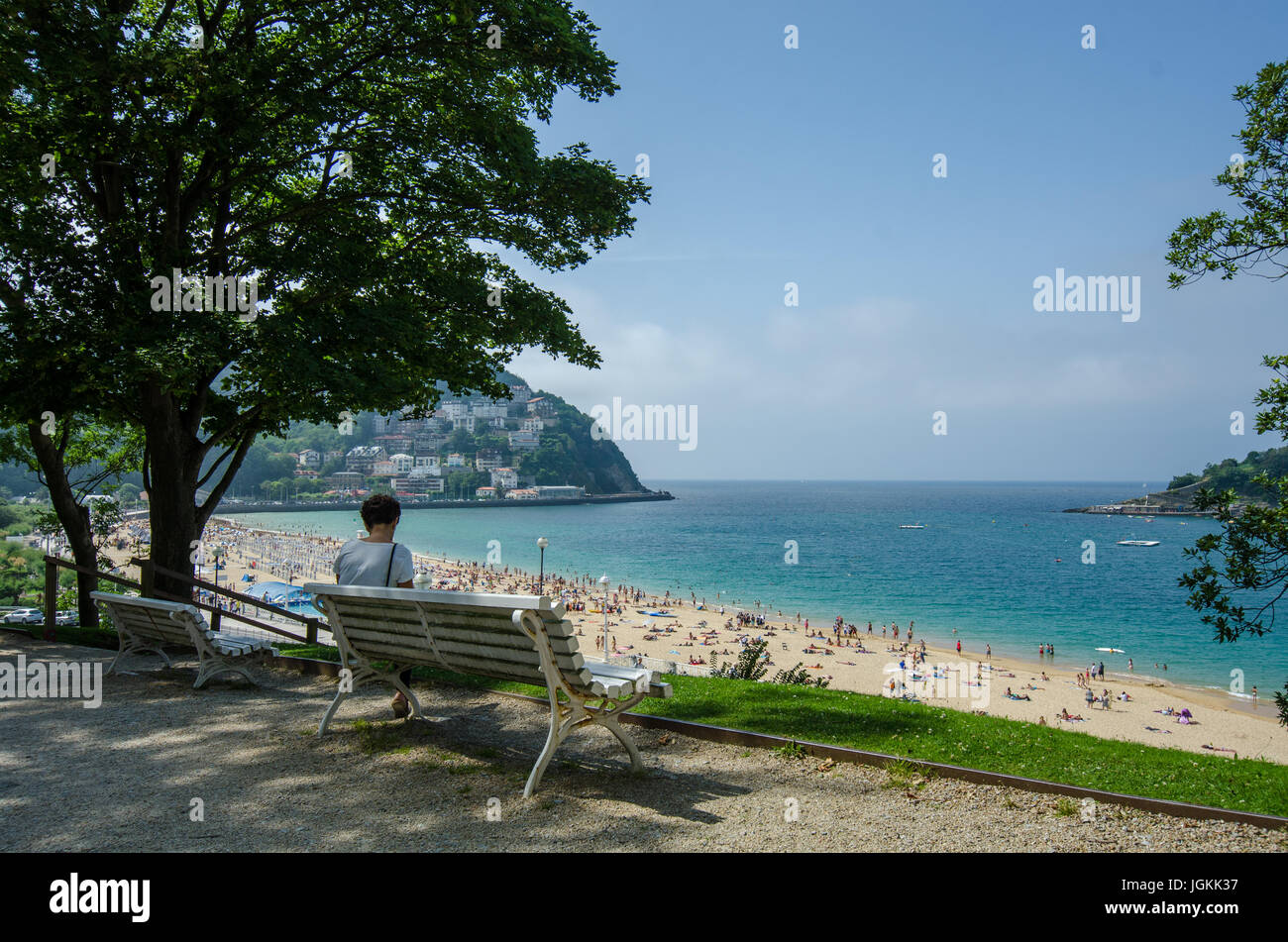 A women relaxing on a bench with beautiful sea view Stock Photo - Alamy