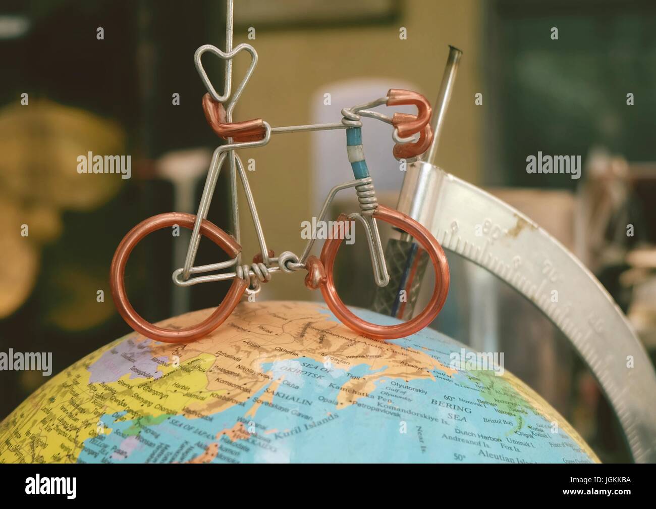 Miniature Bicycle Figure on Geography Globe or Planet Sphere Model ...
