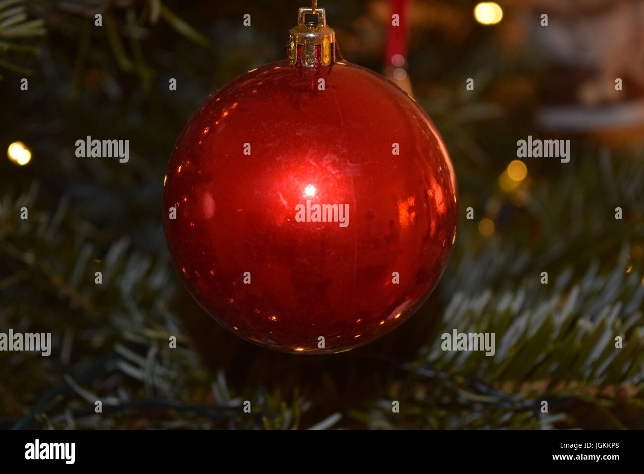 Bauble hanging from tree hi-res stock photography and images - Alamy
