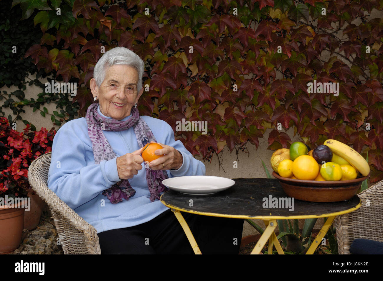 senior woman with a orange Stock Photo - Alamy