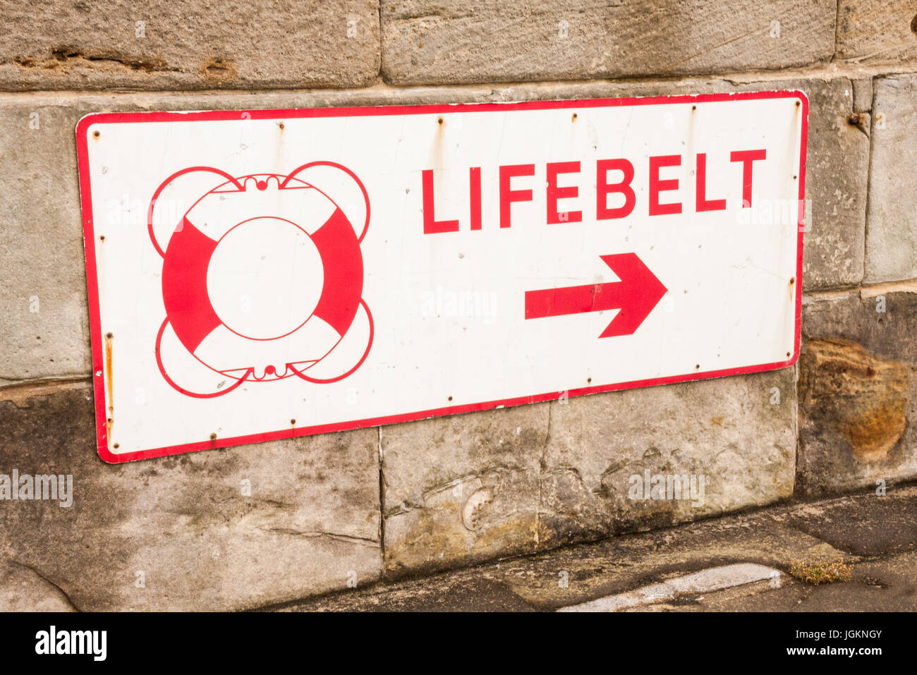 Directional sign showing location of the lifebelt at the headland at ...