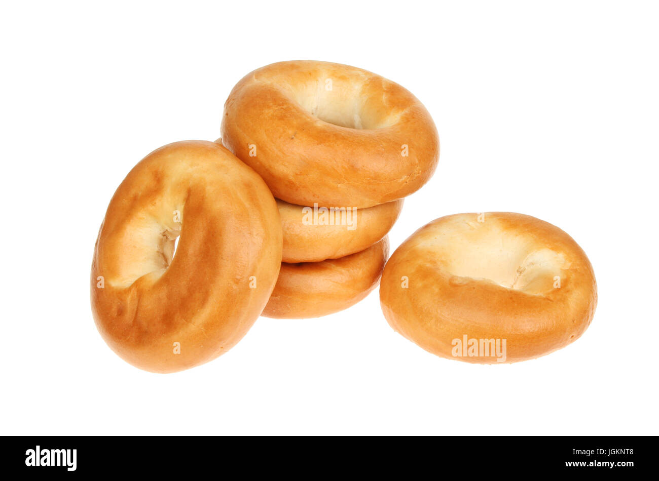 Stack of plain bagels isolated against white Stock Photo - Alamy