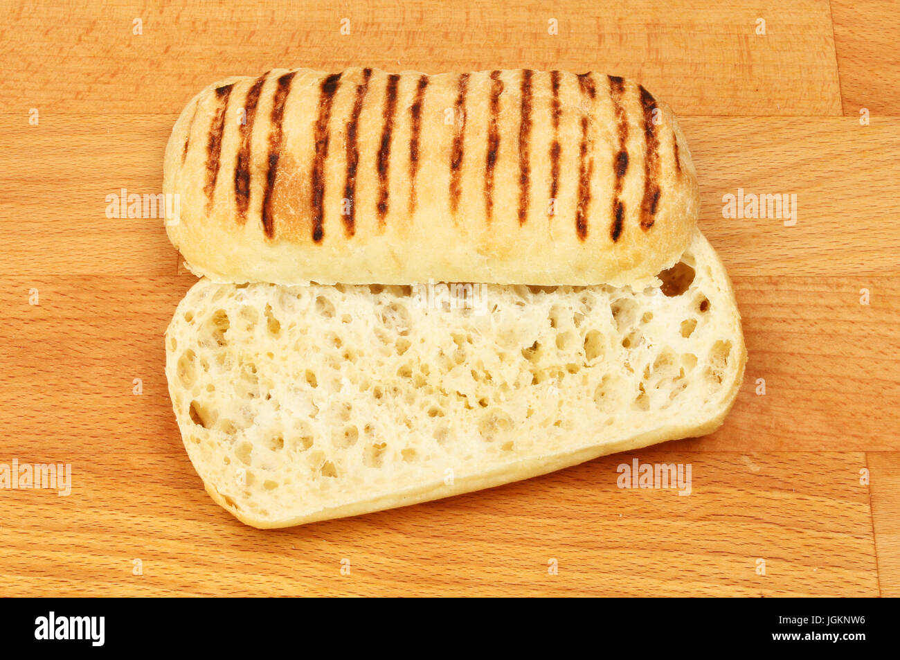 Sliced Panini Bread Roll On A Wooden Chopping Board Stock Photo Alamy sliced-panini-bread-roll-on-a-wooden-chopping-board-stock-photo-alamy