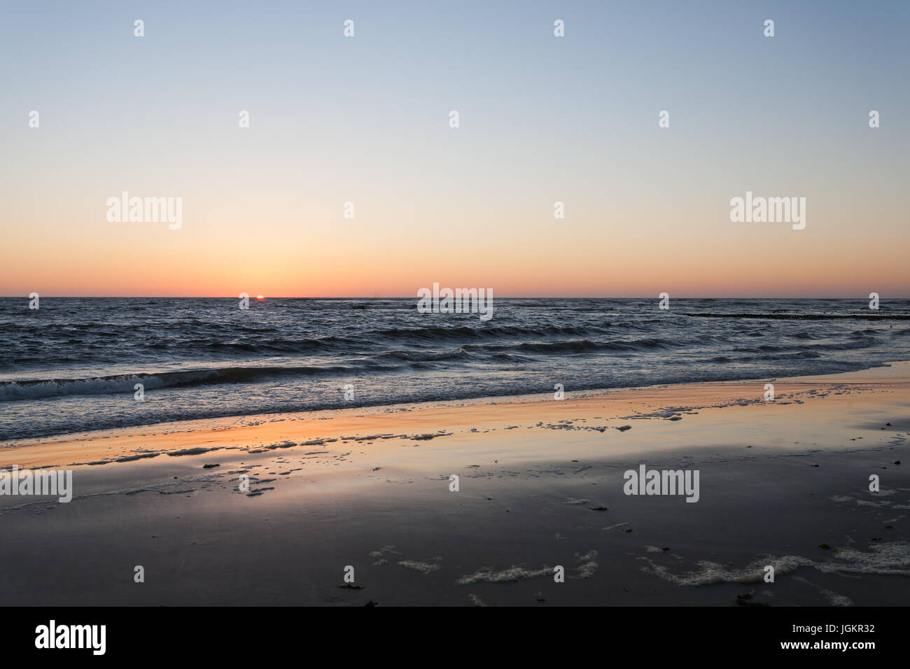 Namibian sunset at Swakopmund beach Stock Photo - Alamy