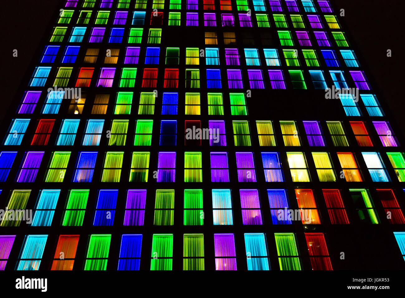Colored windows texture. Windows illuminated by neon lights background ...