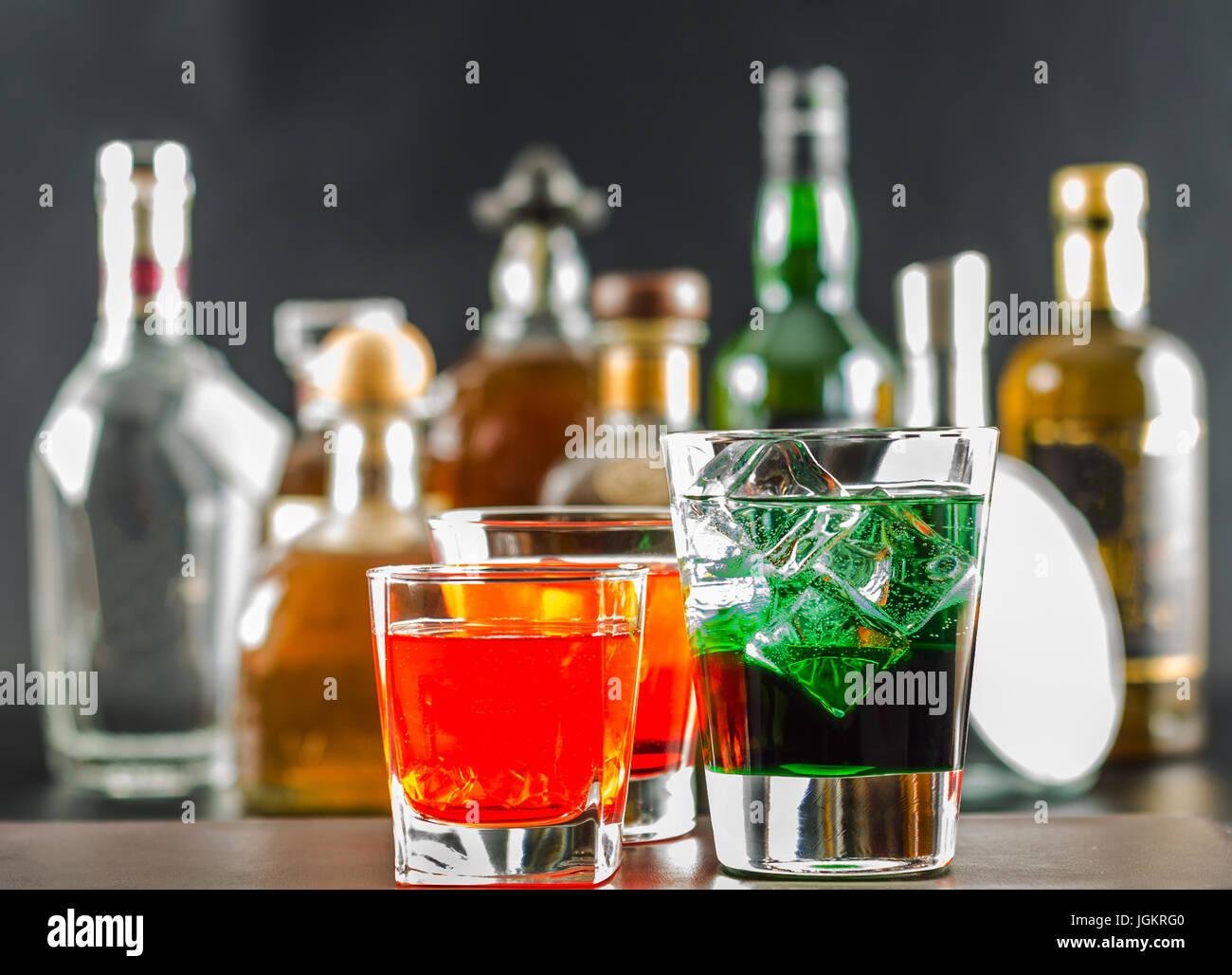 Colorful drink on the background of bottles in original shapes ...