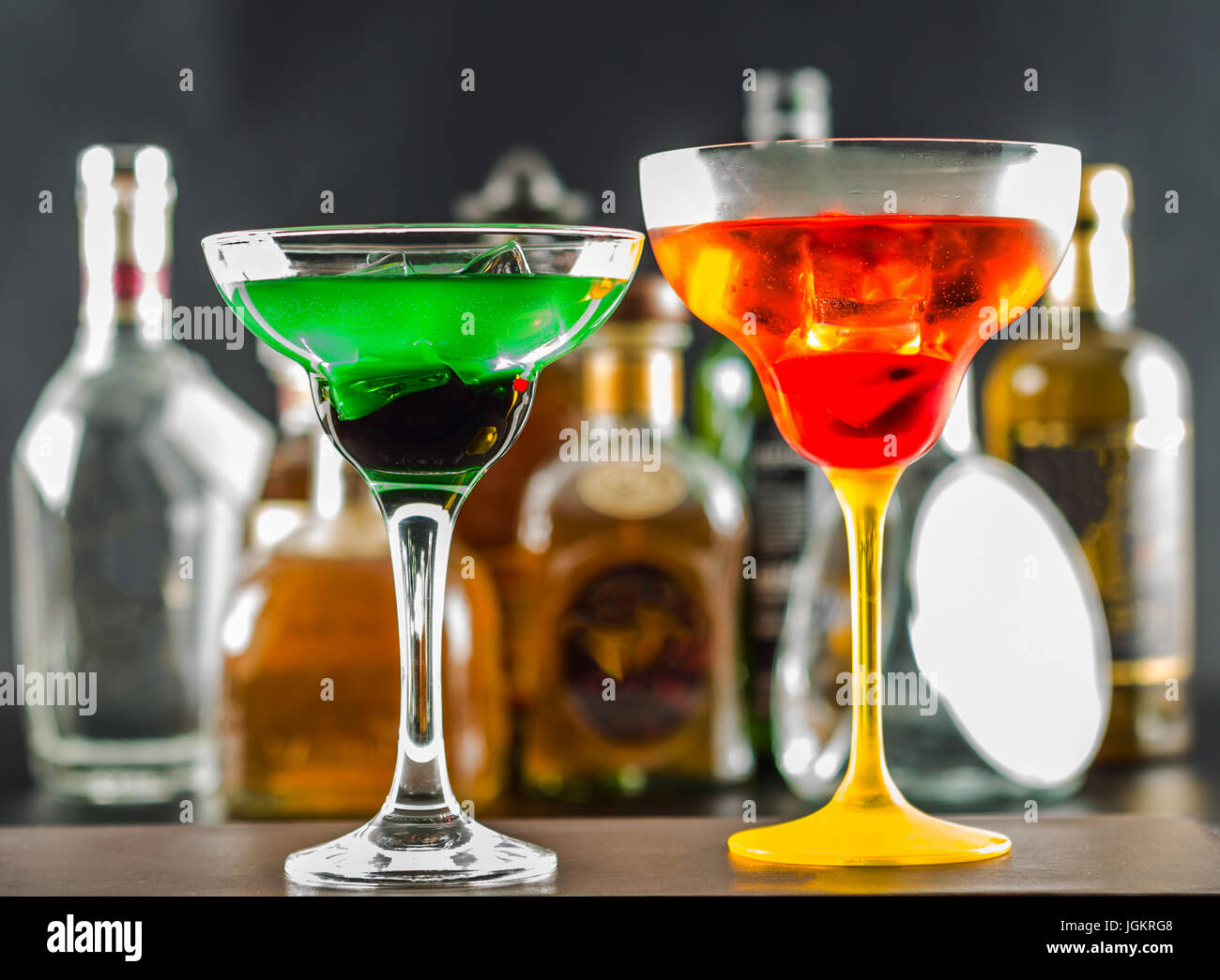 Colorful drink on the background of bottles in original shapes ...