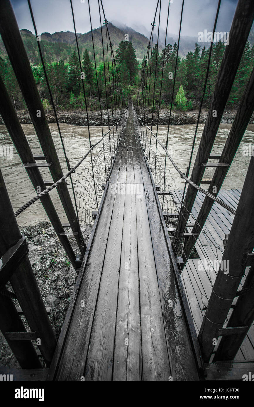 Woman hiking over stone bridge hi-res stock photography and images - Alamy