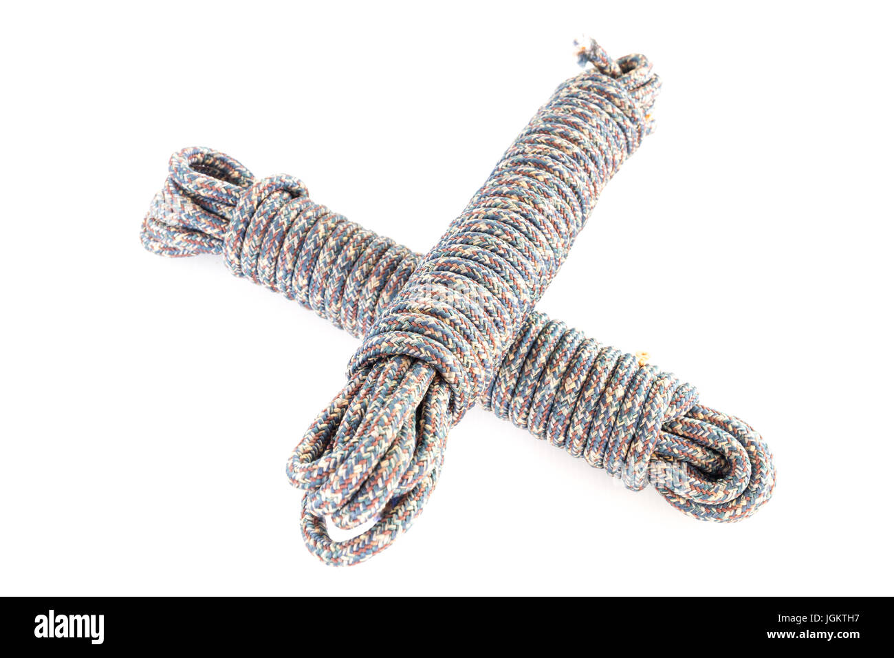 Twisted thick rope on white Stock Photo - Alamy