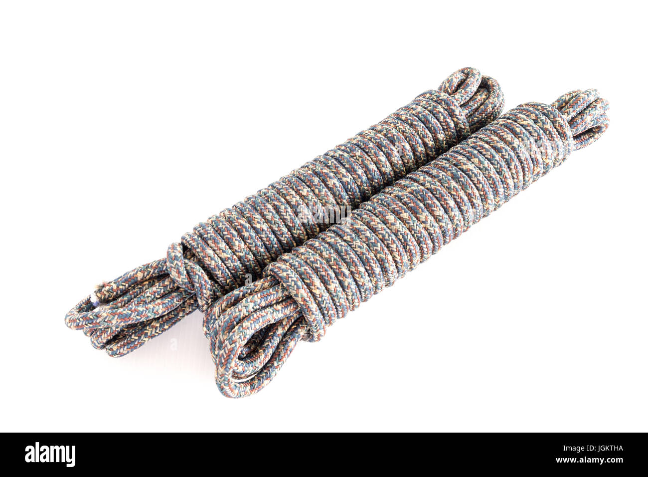 Twisted thick rope on white Stock Photo - Alamy