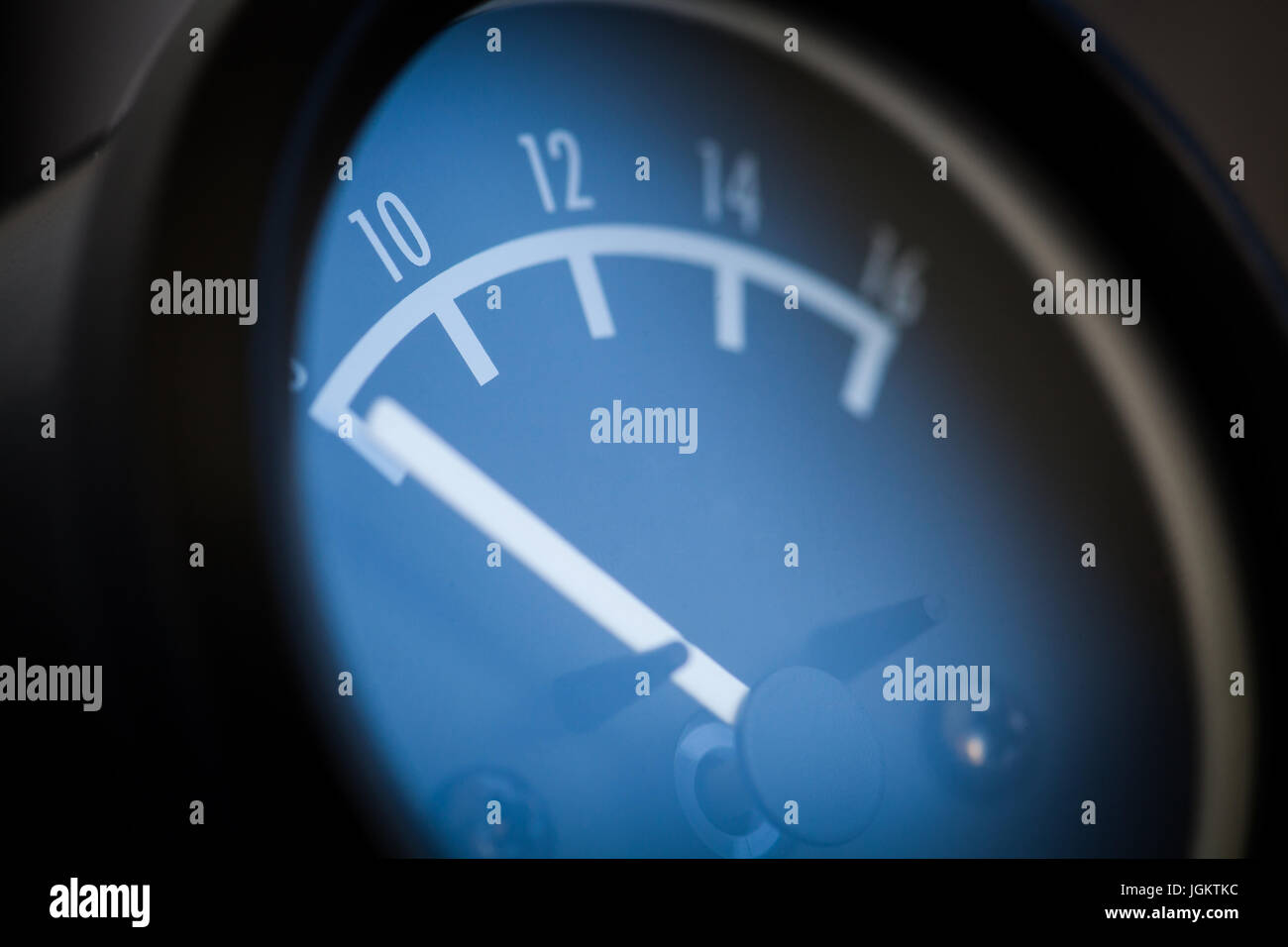 Close up shot of an analog car volt meter Stock Photo - Alamy