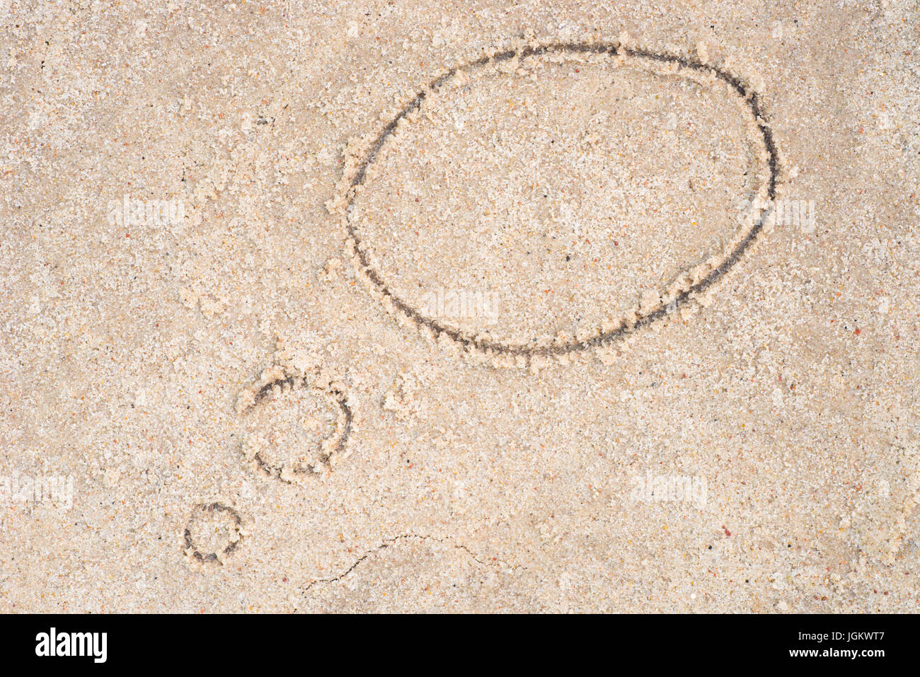speech bubble drawing in sand background Stock Photo - Alamy