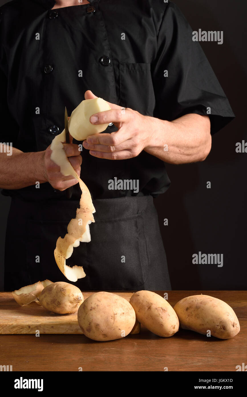 chef peeling potatoes Stock Photo - Alamy
