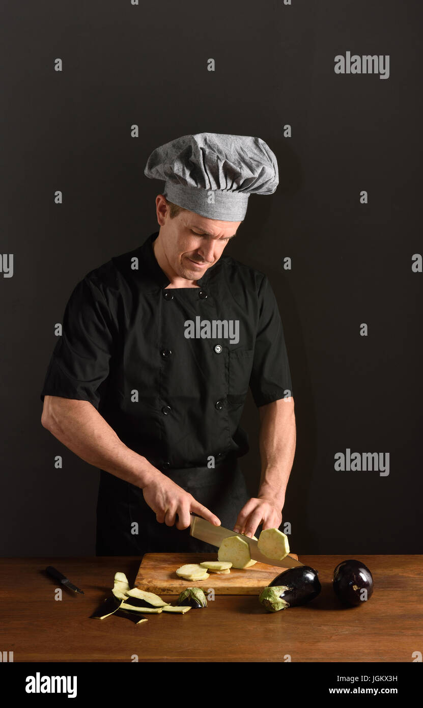 Professional chef cutting eggplant hi-res stock photography and images ...