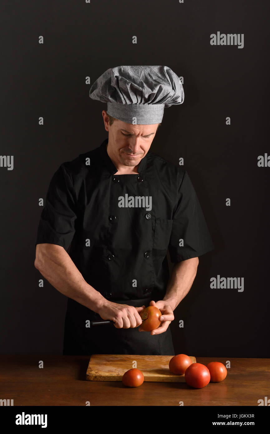 chef slicing tomato Stock Photo - Alamy
