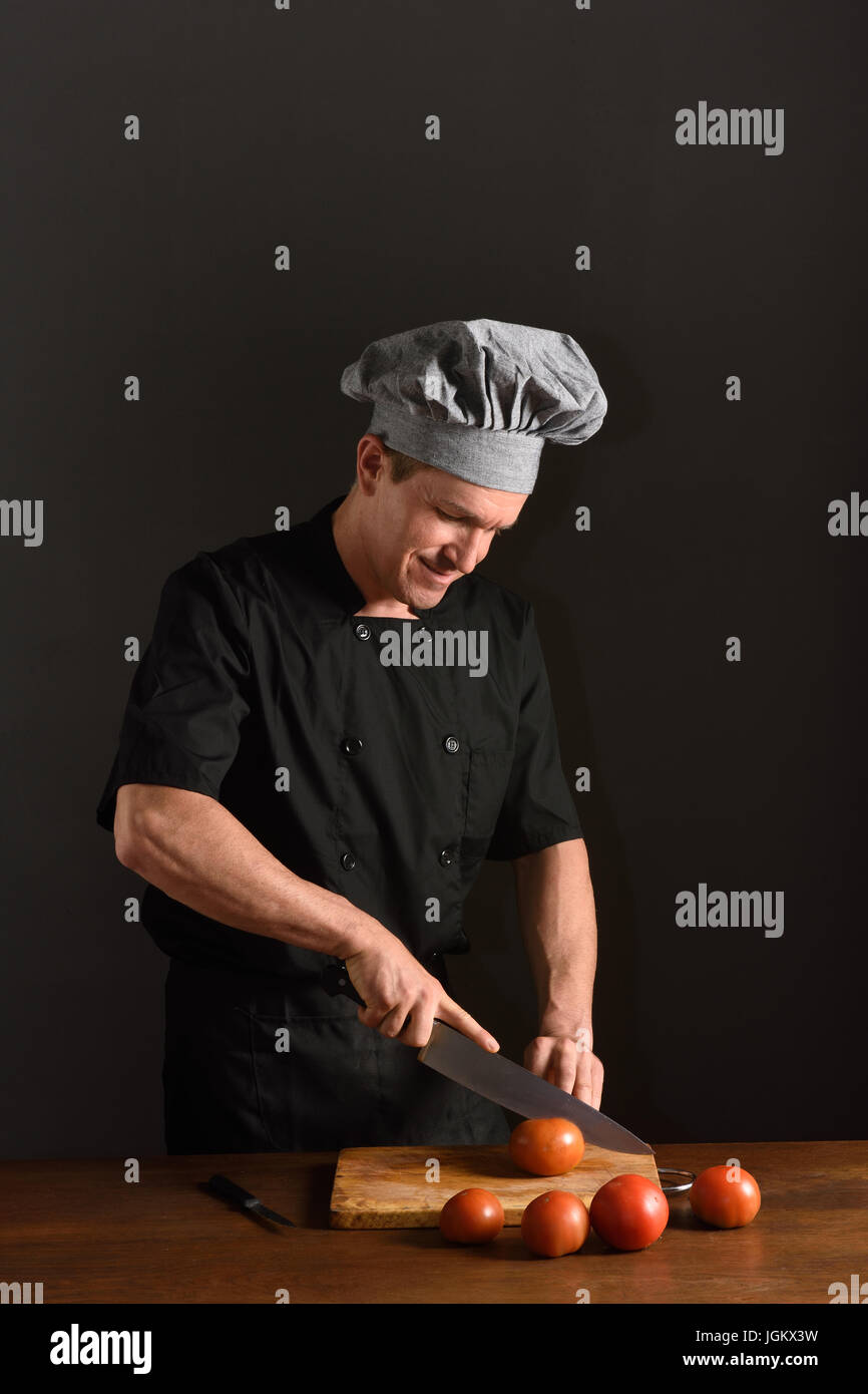 chef slicing tomato Stock Photo - Alamy