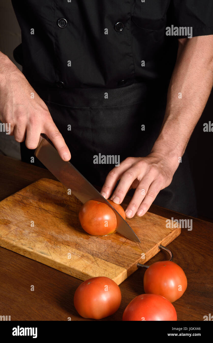 chef slicing tomato Stock Photo - Alamy