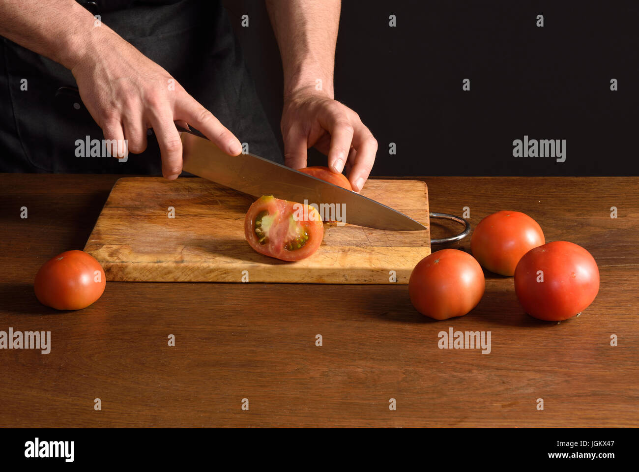 Male hands cutting tomato slicing hi-res stock photography and images ...