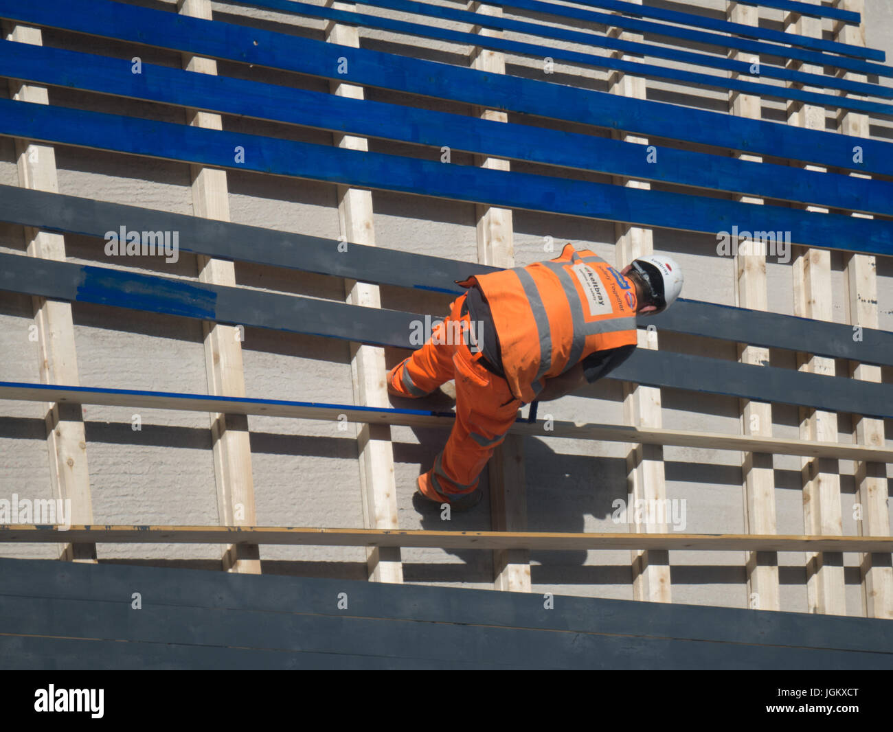 Man painting girders Stock Photo - Alamy