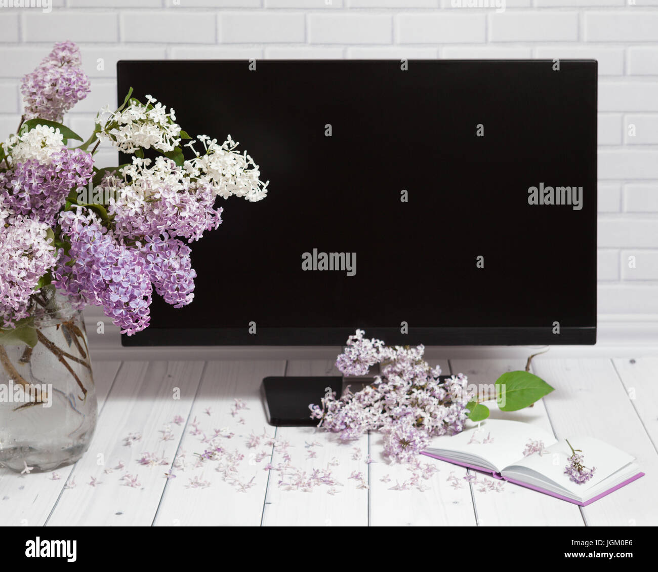 Beautiful white and violet lilac flowers bouquet in vase with opened ...