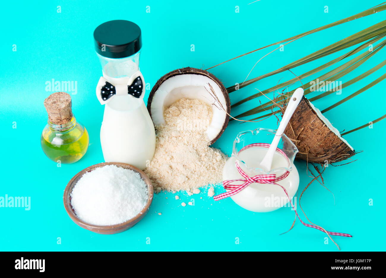 Various coconut products collection against blue background Stock Photo ...