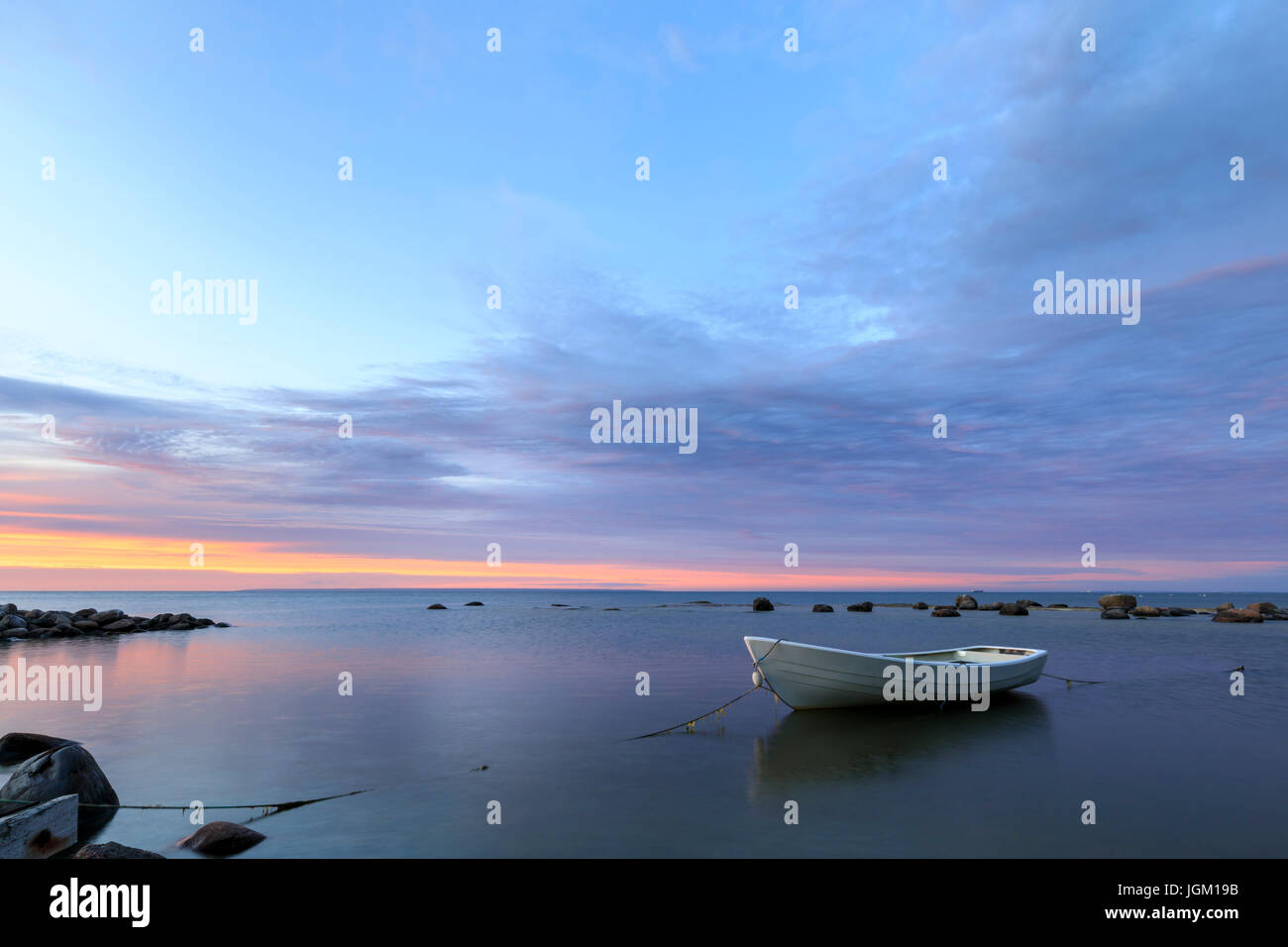 White oar boat at seashore in sunset Stock Photo - Alamy