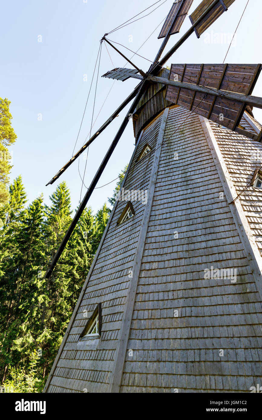 Ancient white wooden windmill with windows in forest in summer Stock ...