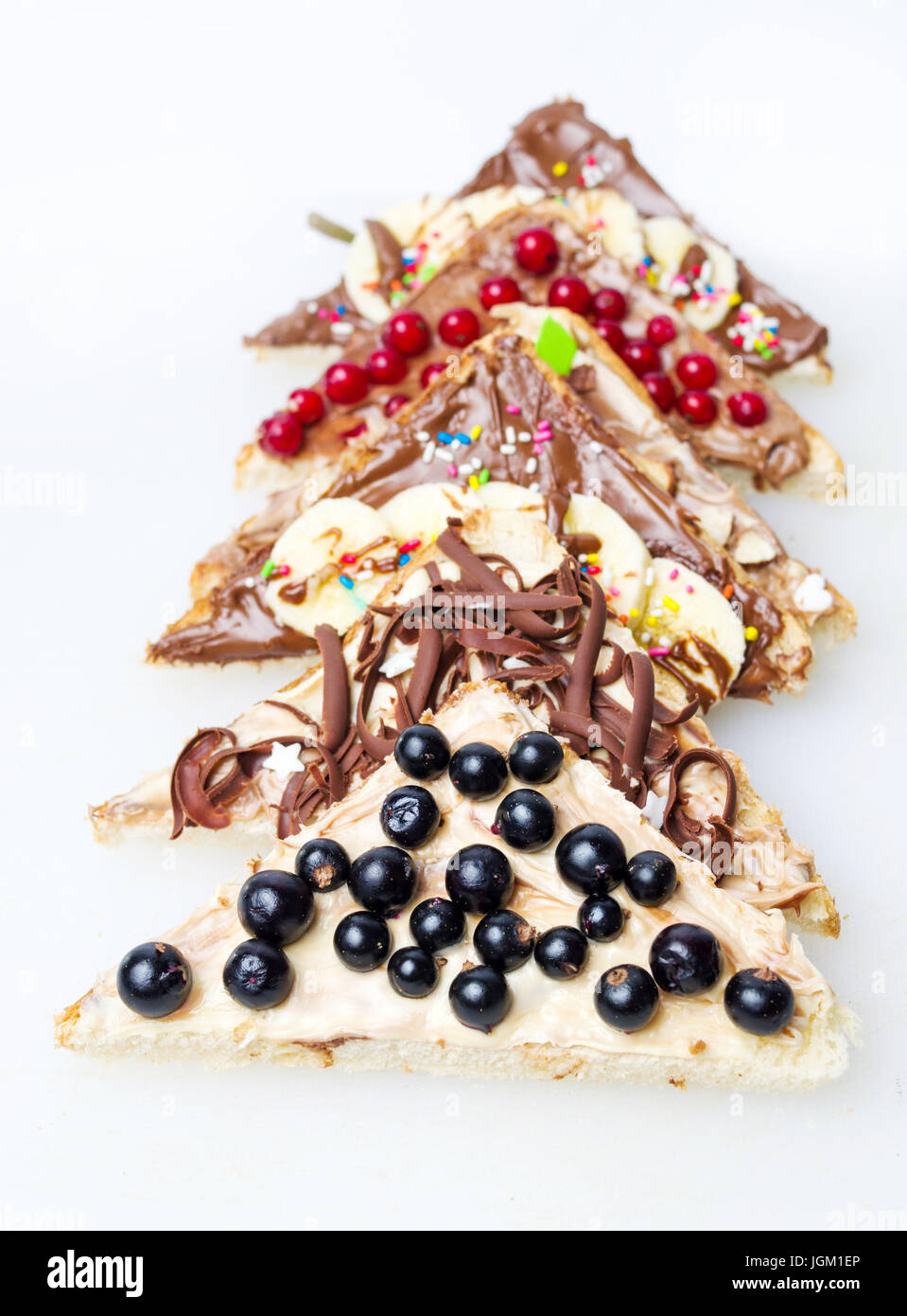 Sweet triangle sandwiches with fruit and cream Stock Photo - Alamy