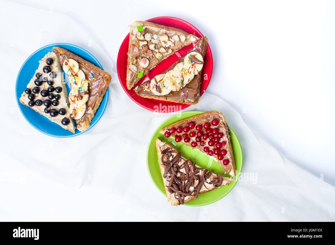 Sweet triangle sandwiches with fruit and cream Stock Photo - Alamy