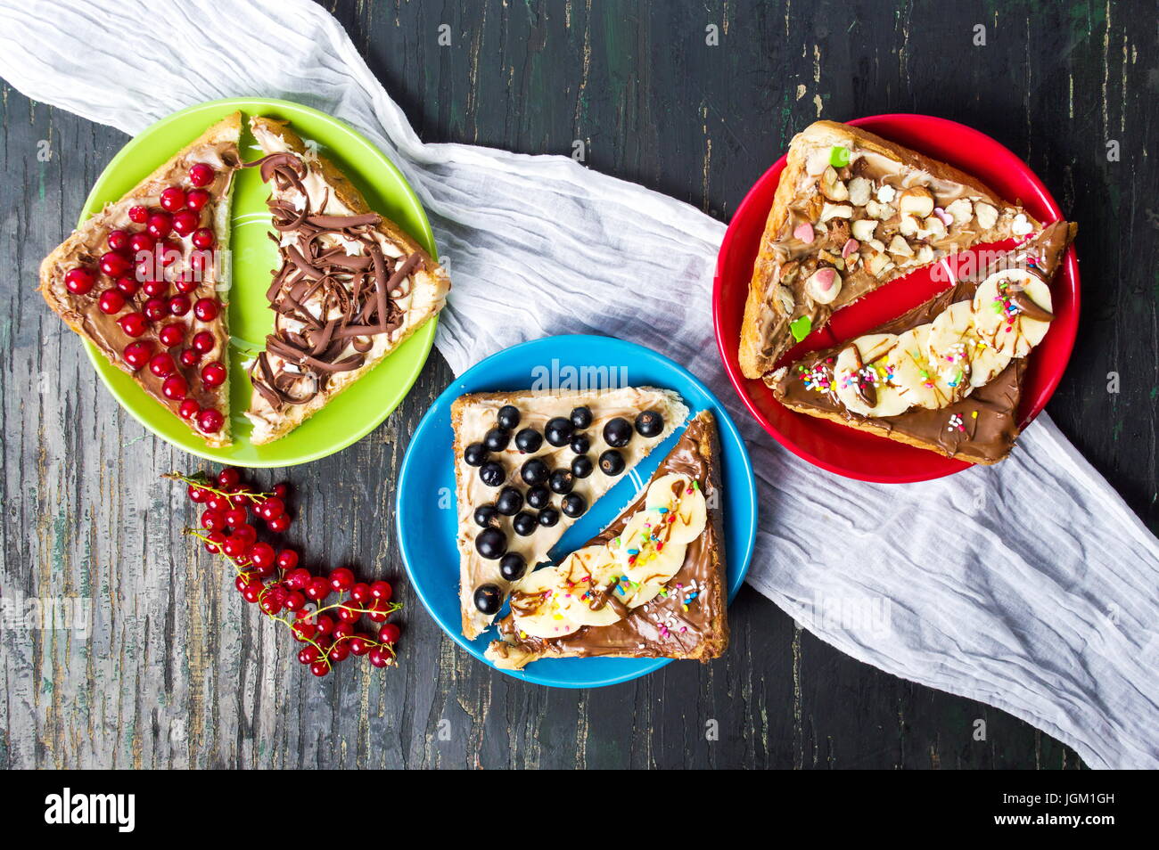 Sweet triangle sandwiches with fruit and cream Stock Photo - Alamy