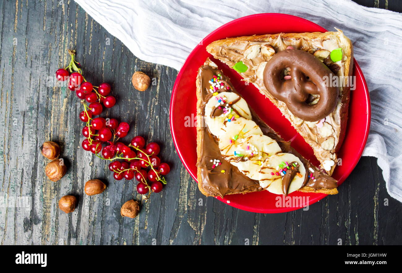 Sweet triangle sandwiches with fruit and cream Stock Photo - Alamy
