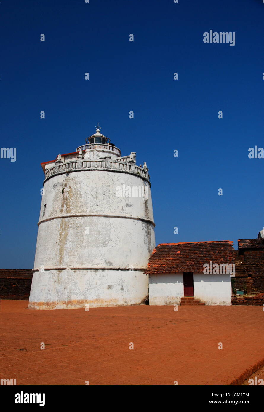 The lighthouse of the Aguada Fort in Candolim, Goa, India overlooking ...