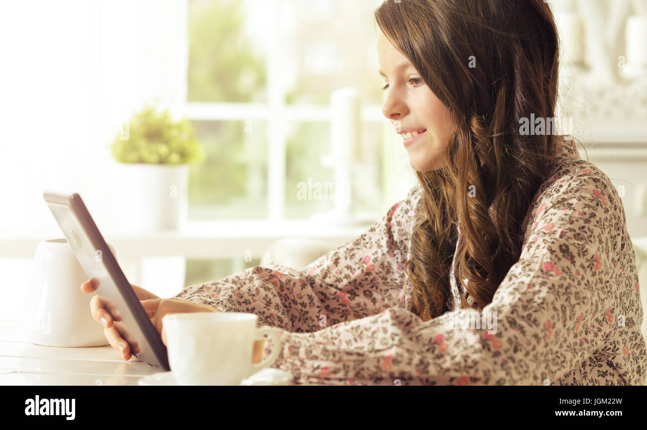 Little girl using tablet Stock Photo - Alamy