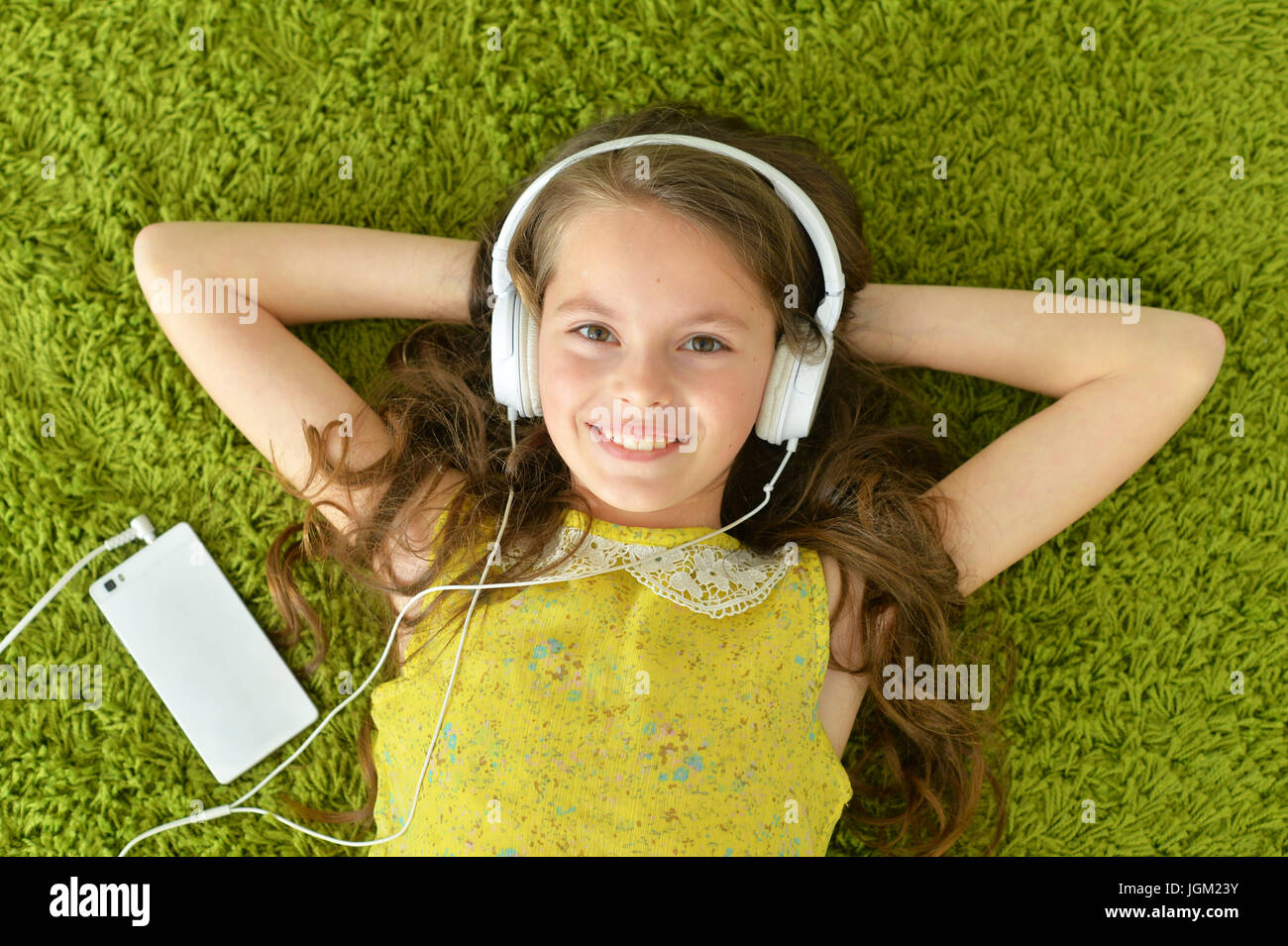 Cute little girl with headphones Stock Photo - Alamy