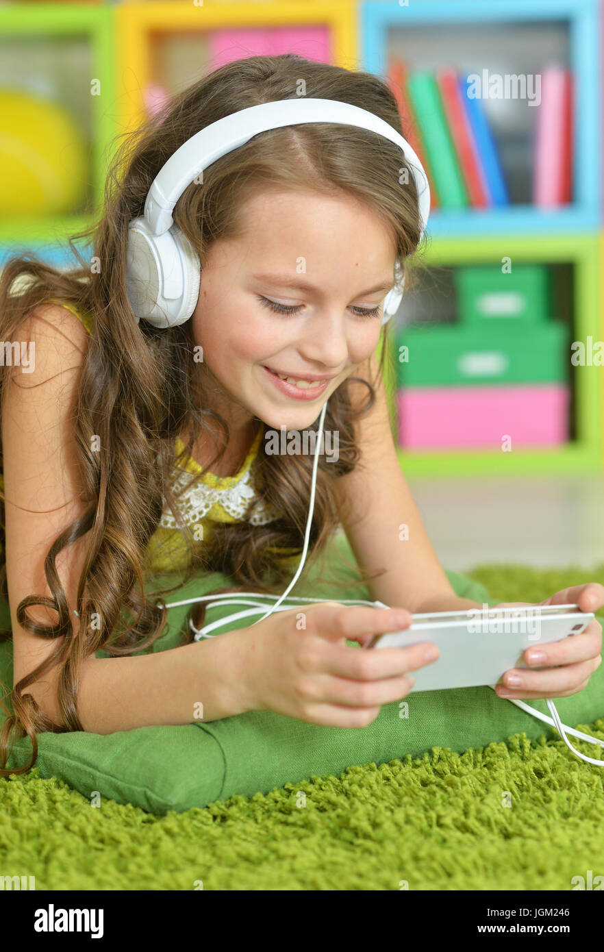 Cute little girl with headphones Stock Photo - Alamy