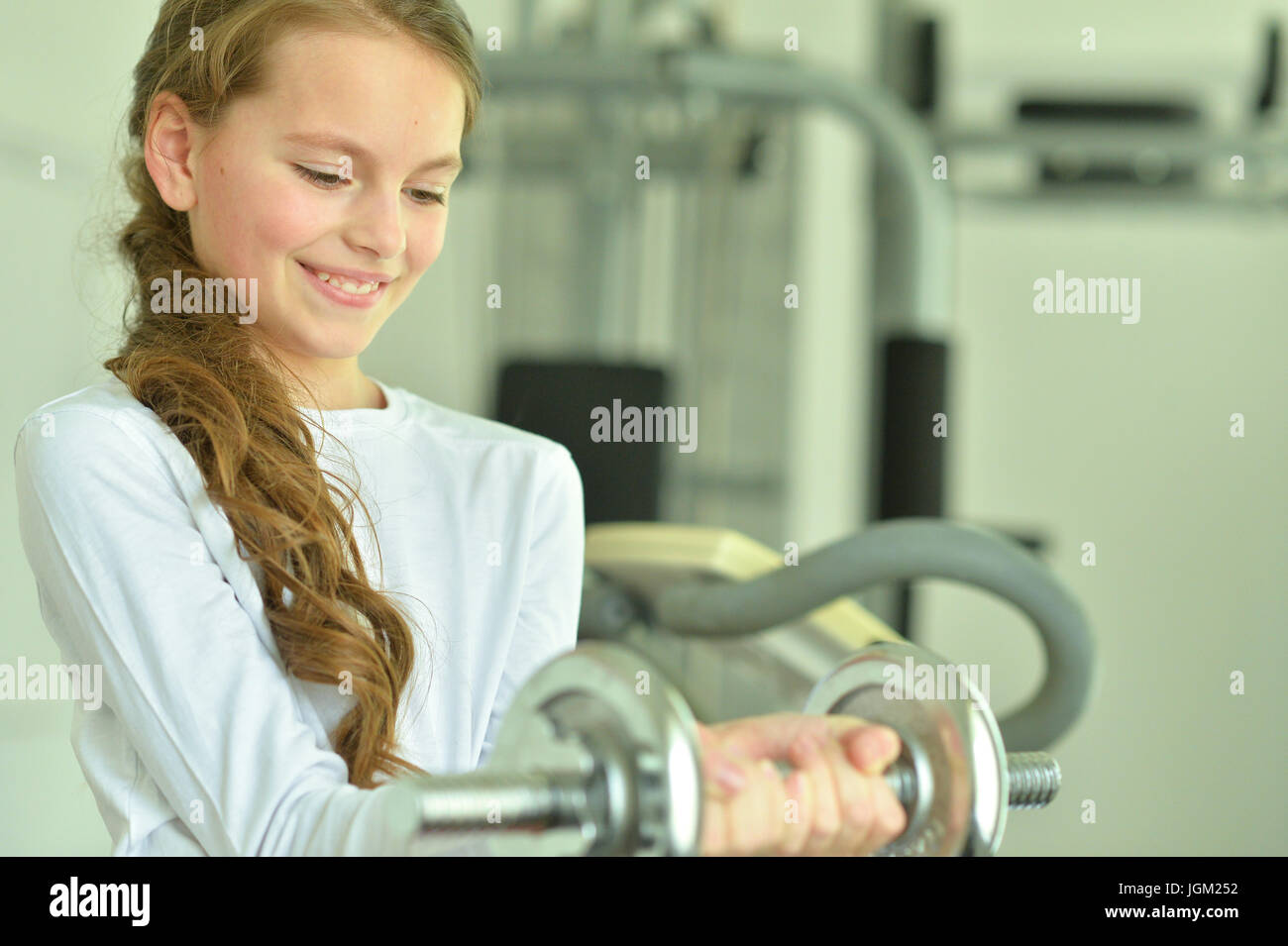 Little girl doing fitness exercises hi-res stock photography and images ...