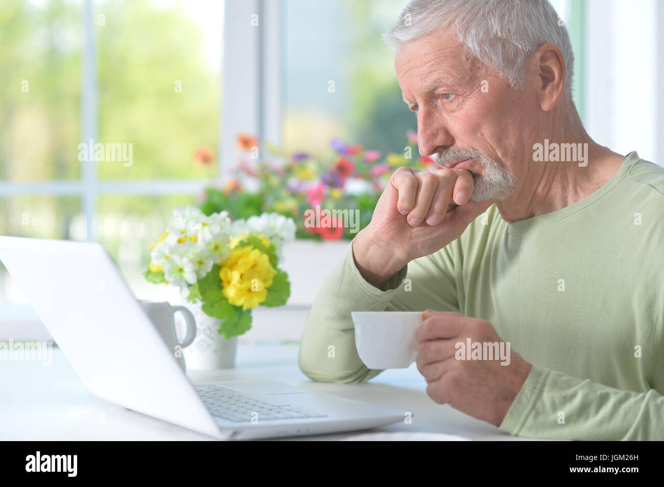 Beautiful old man with a laptop Stock Photo - Alamy