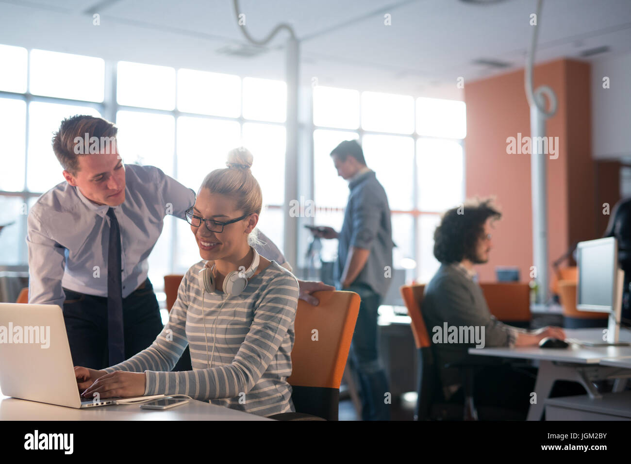 two business people using laptop preparing for next meeting and ...