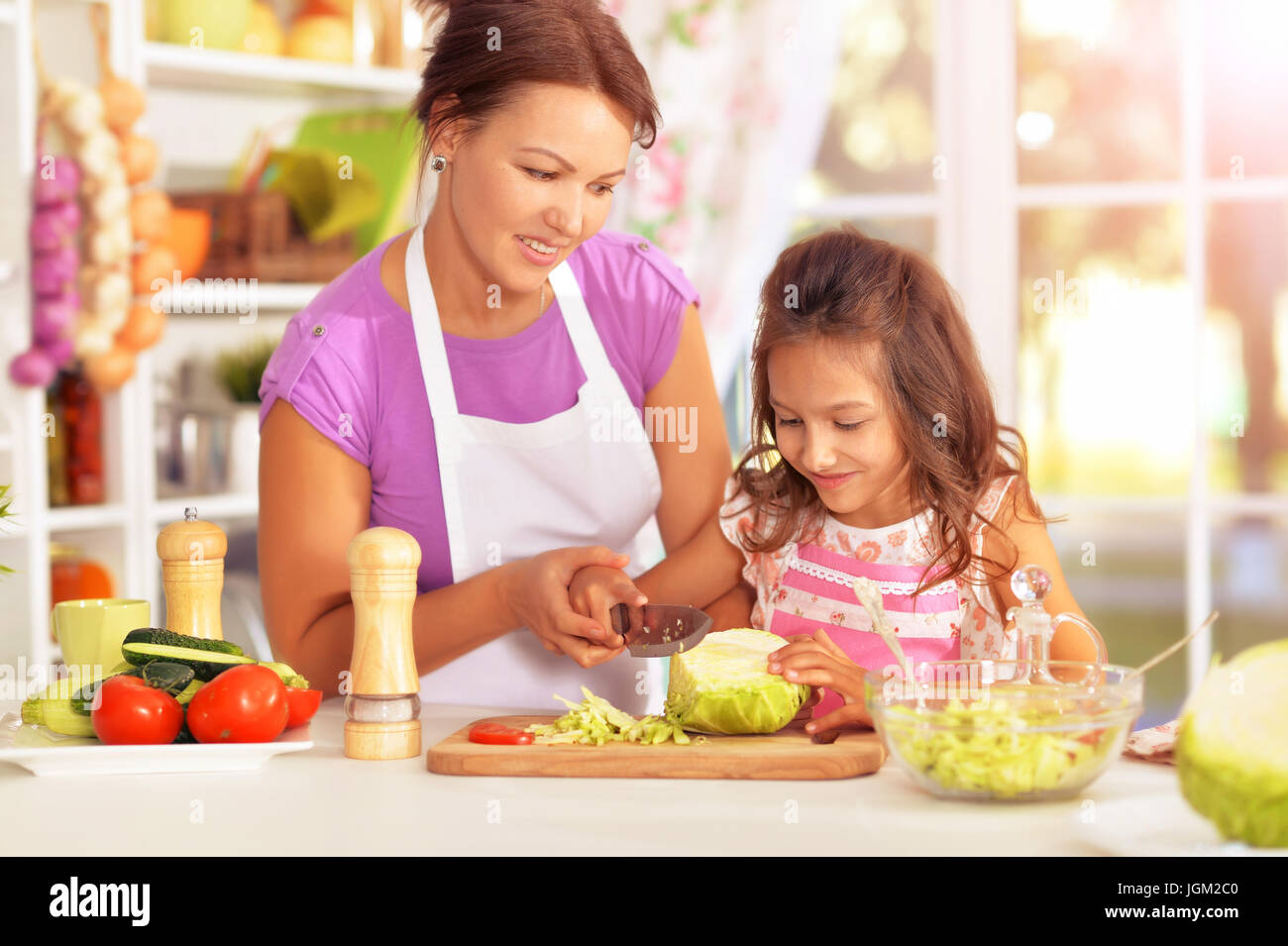 mother and daughter cooking salad Stock Photo - Alamy