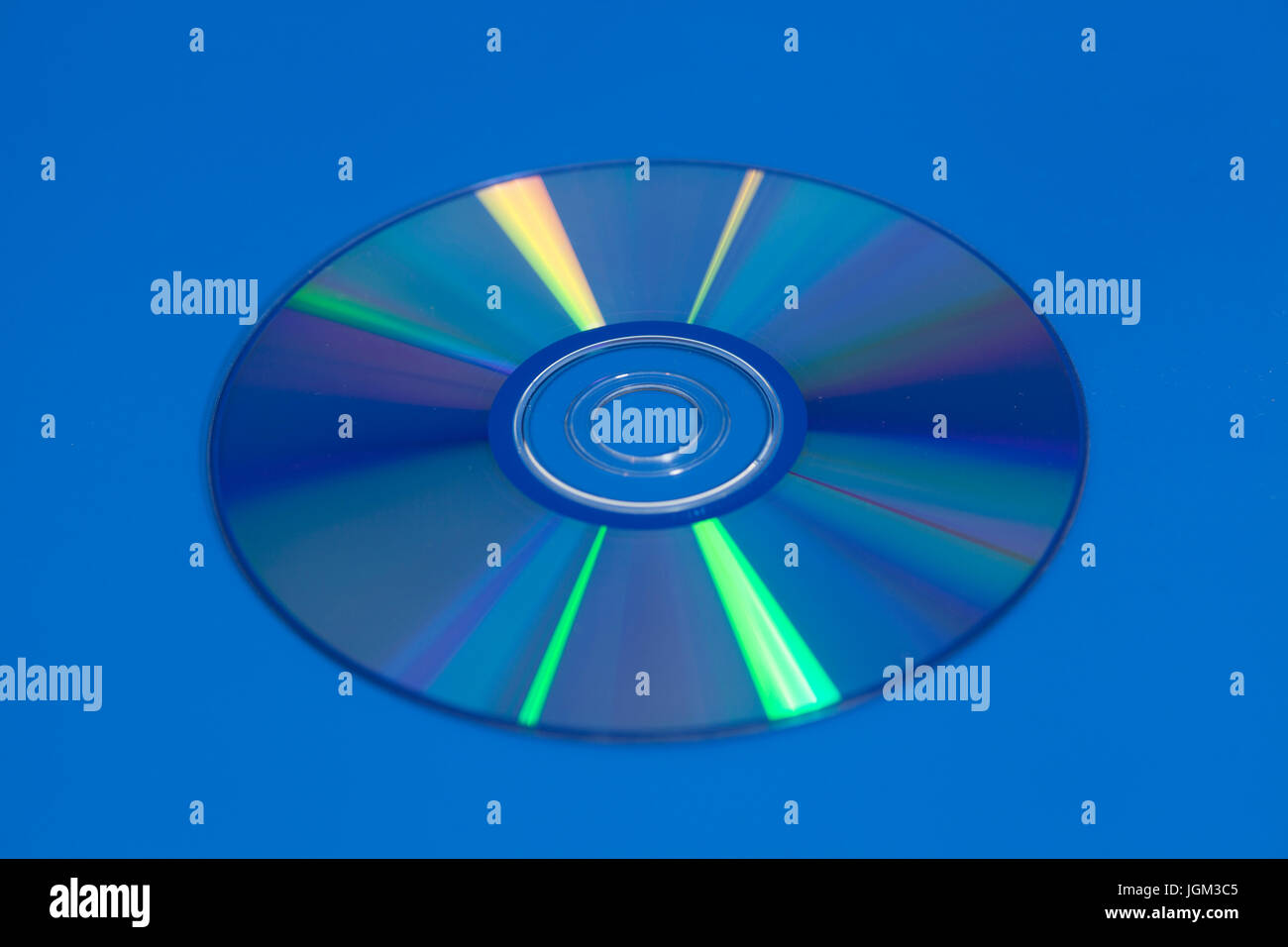 Compact Dvd Cd disk on blue background Stock Photo - Alamy