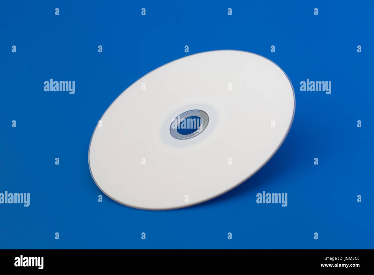 Compact Dvd Cd disk on blue background Stock Photo - Alamy